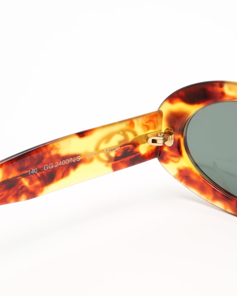 Vintage Gucci Orange Sunglasses with Gold-Tone Hardware - A Retro Tale